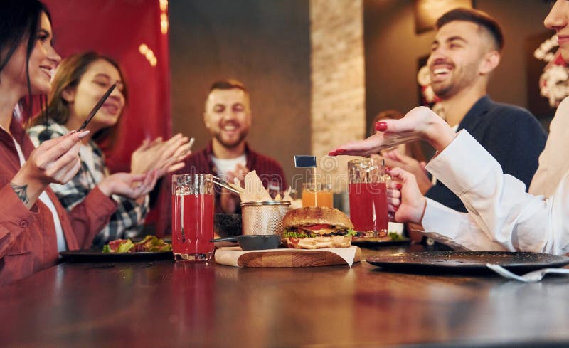 Sitting Together. Group of Young Friends in Bar with Beer Stock Image ...