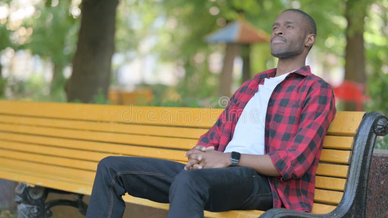 Sitting Young African Man Leaving Bench in Park Stock Photo - Image of ...