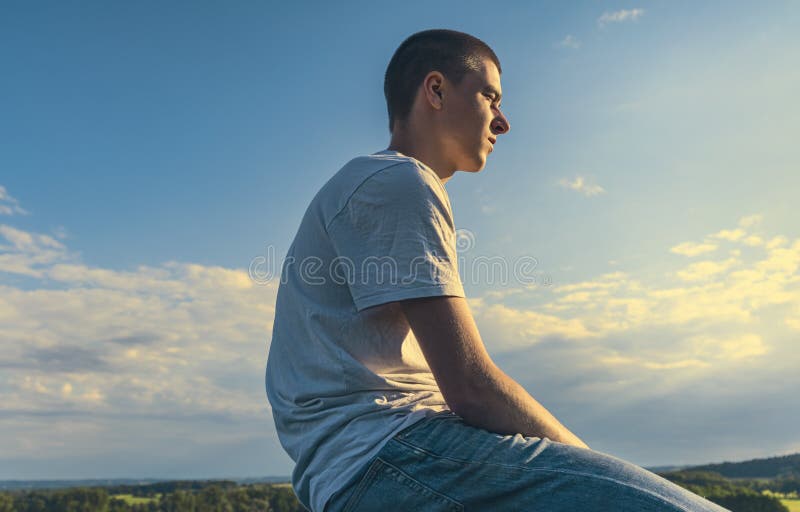 Sitting Young Man in Profile Stock Photo - Image of looks, leisure ...
