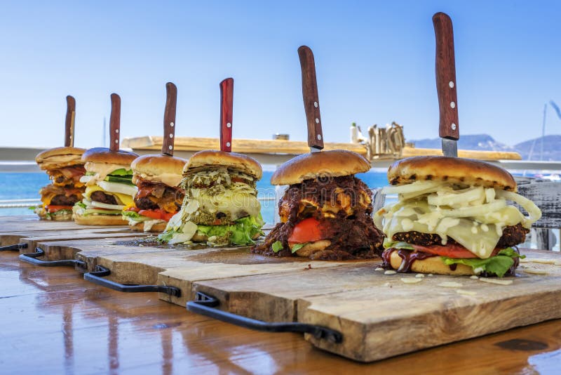 Six big burger on a table stock photo. Image of food - 262982780