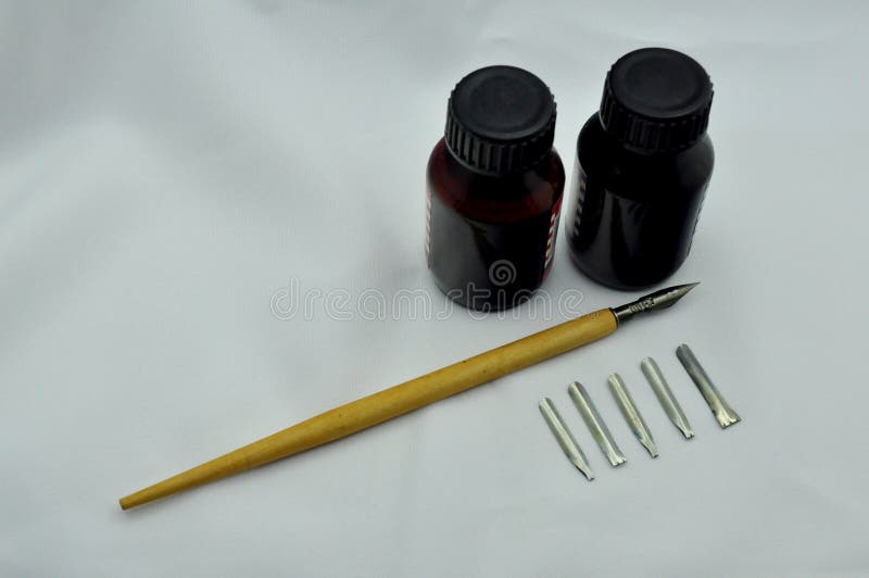 Two pens for calligraphy stock image. Image of golden - 17043541