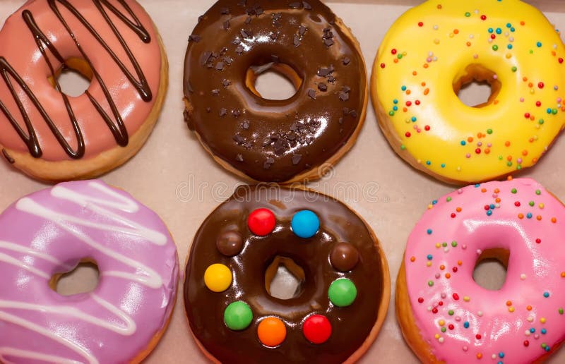 Six Colored Donuts in a Box. Sweet Donuts with Glaze Stock Photo ...