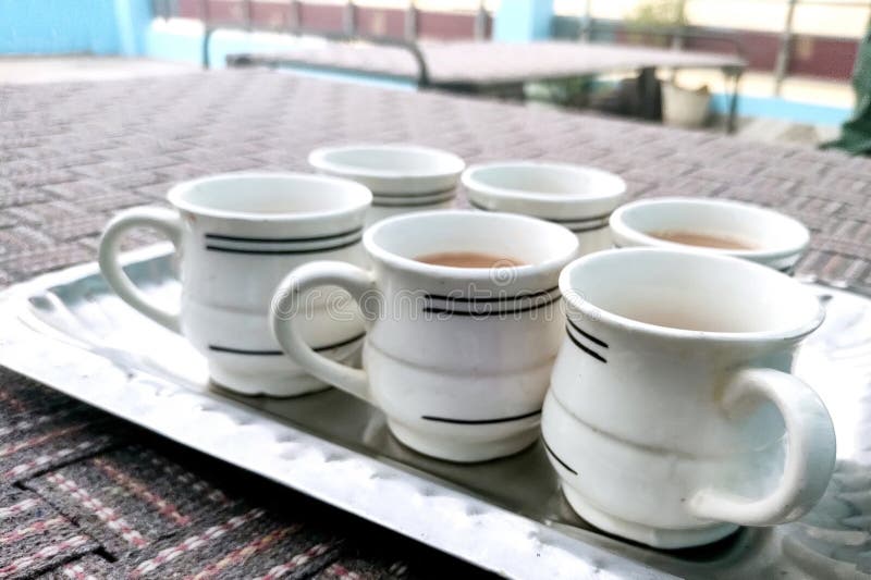 Six cups of tea in a tray stock image. Image of table - 322022005