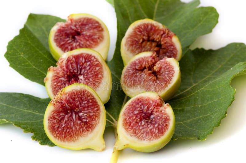 Six Fig Halves, Red and Juicy, on a Green Leaf. Stock Photo - Image of ...
