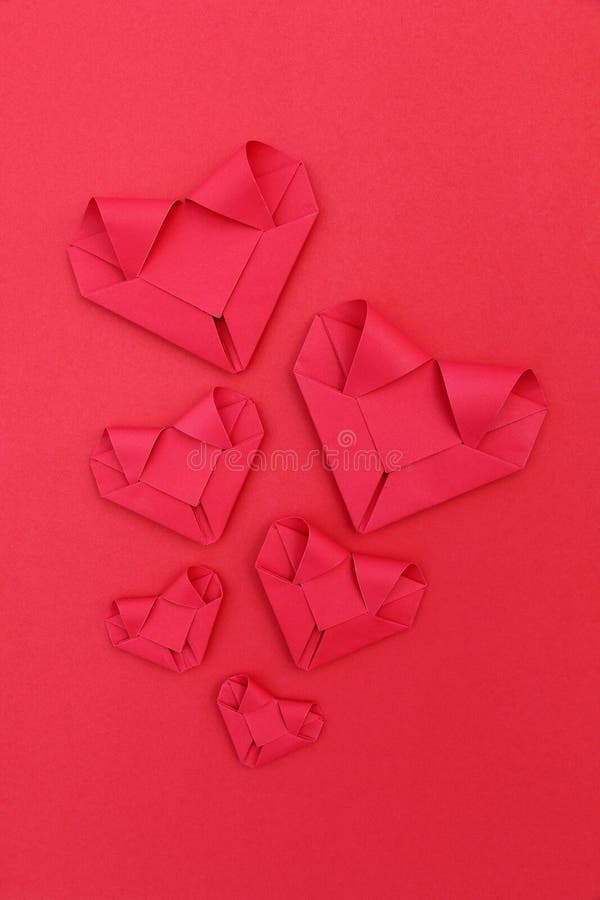 Two Folding Red Paper Hearts on Yellow Concrete Wall for Pattern Stock ...