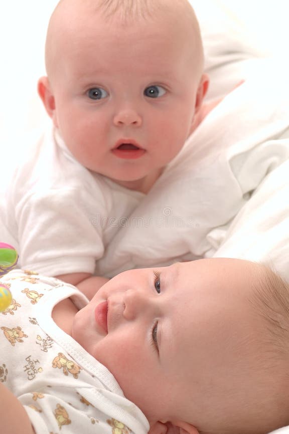 Six month old twin babies stock image. Image of couple - 17761849