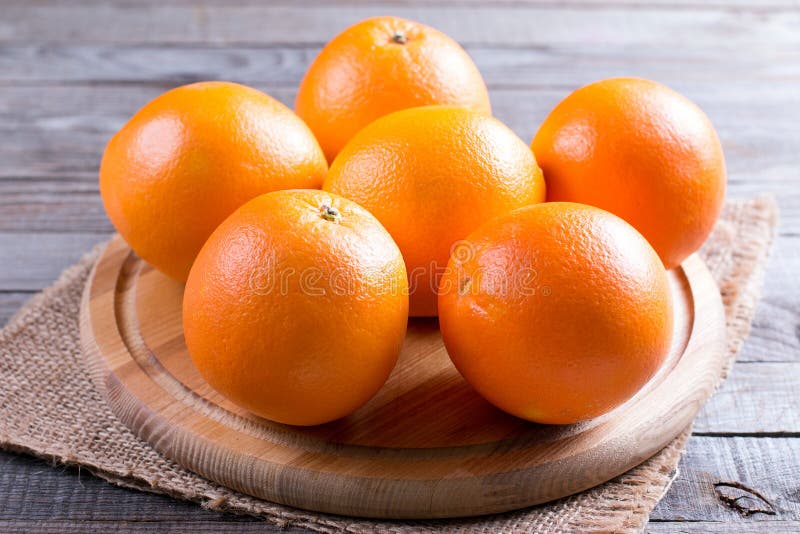 Six Oranges on a Cutting Board Stock Photo - Image of ripe, brown ...