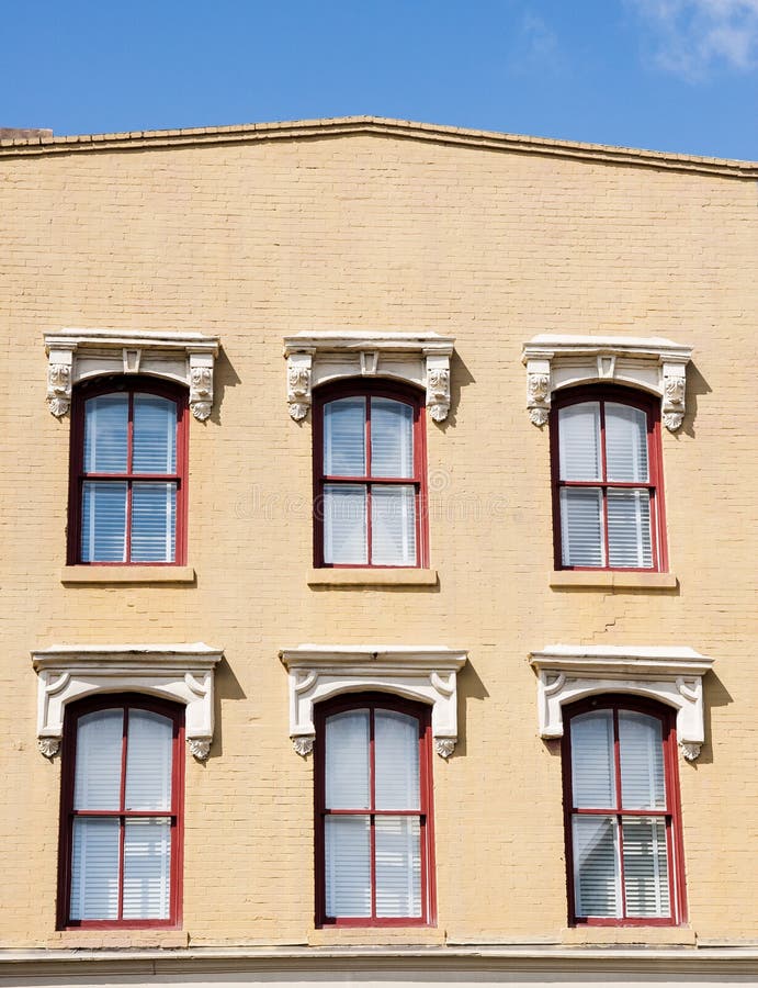 Six Red Windows in Old Brown Brick Building Stock Photo - Image of ...