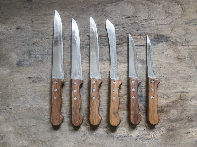 Six Sharp Knives on Old , Rustic Wooden Table Stock Photo - Image of ...
