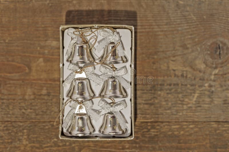 Six Small Christmas Bells in Box on Table Stock Image - Image of school ...