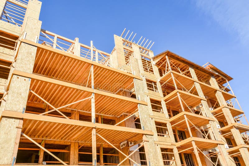 Six Storey Wooden Frame Building Under Construction on Blue Sky ...