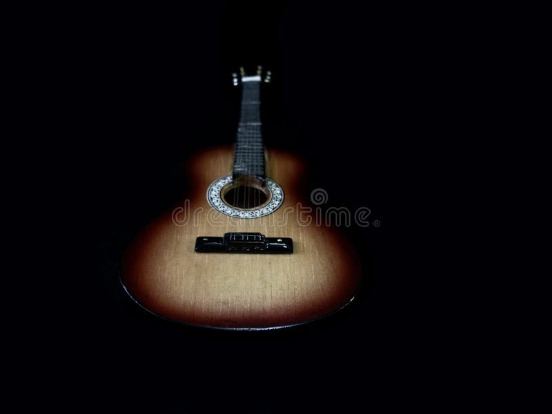 Six-stringed Acoustic Guitar on a Black Background. Musical String ...