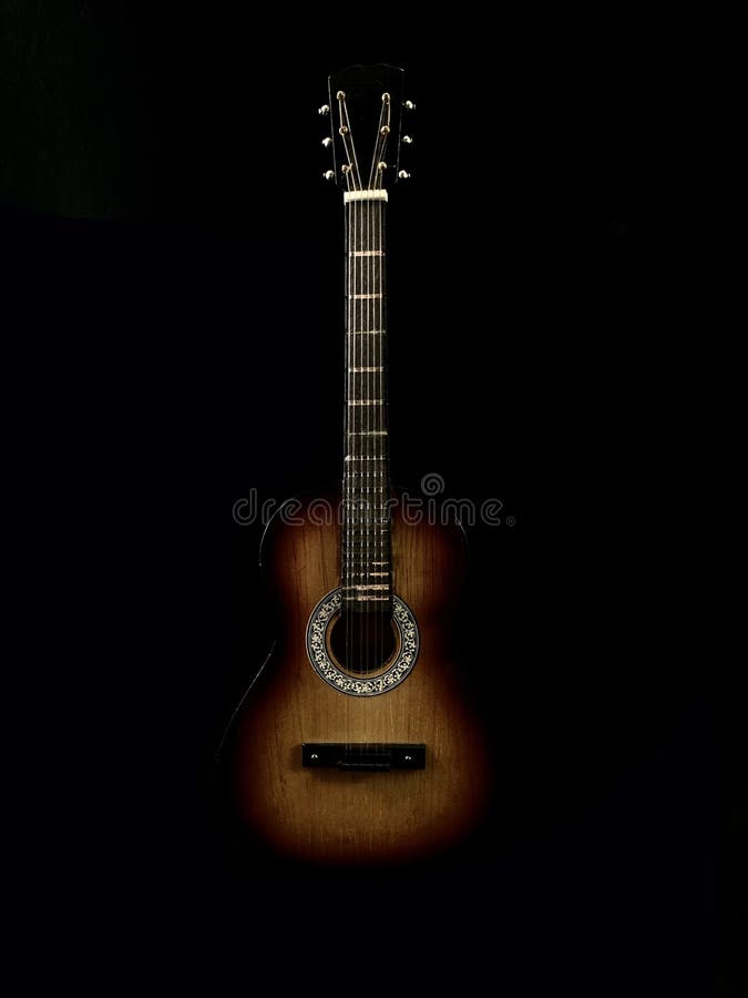 Six-stringed Acoustic Guitar on a Black Background. Musical String ...