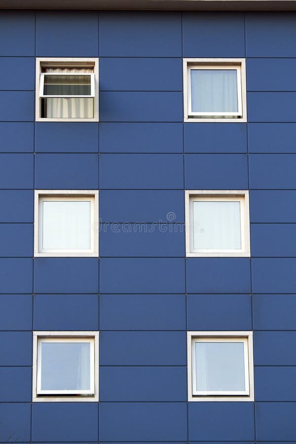 Six Windows on a Blue Building Stock Photo - Image of house, building ...