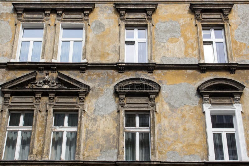 Six Windows on the Facade of the Ragged Old House Stock Photo - Image ...