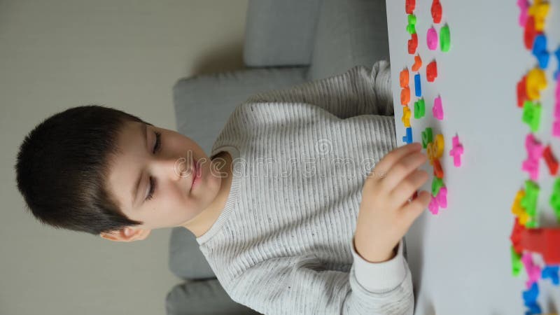 A Six-year-old Child Learns Math by Playing with Figures Numbers ...