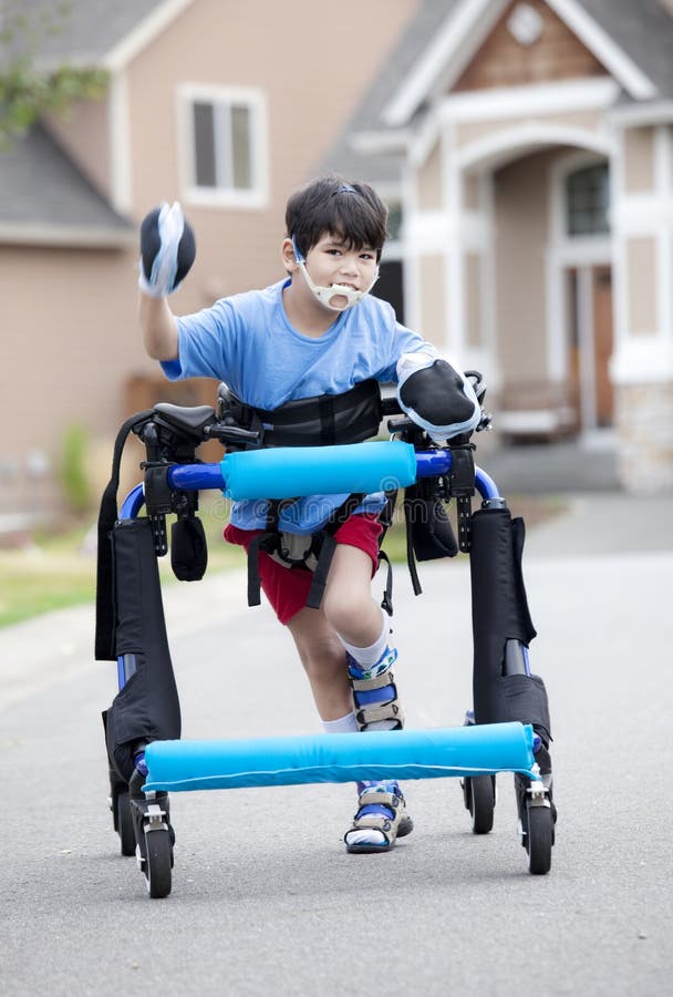 Six Year Old Disabled Boy in Walker on Street Stock Photo - Image of ...