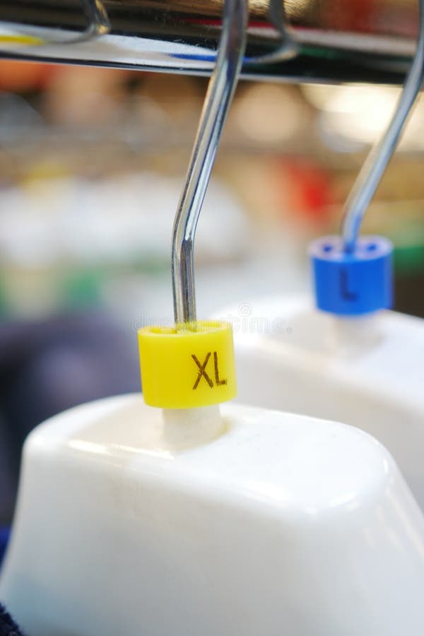 Size marker on the hanger. stock photo. Image of closet - 301738618