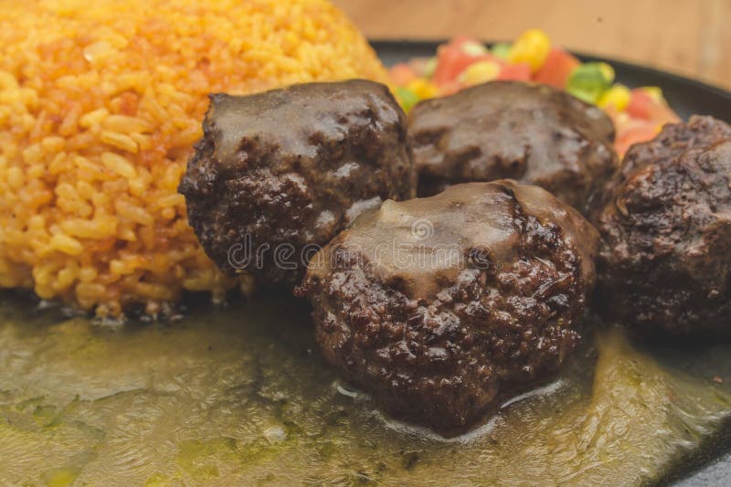 Sizzling Beef Meatballs Served with Mixed Vegetables and Java Rice on a ...