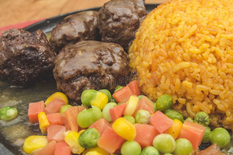 Sizzling Beef Meatballs Served with Mixed Vegetables and Java Rice on a ...