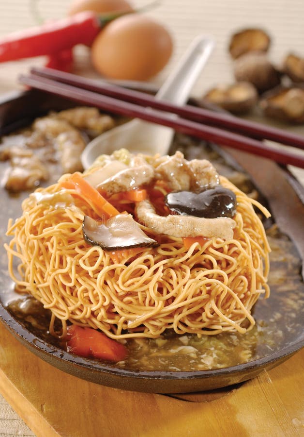 Sizzling crispy noodle stock photo. Image of chopsticks - 11564744