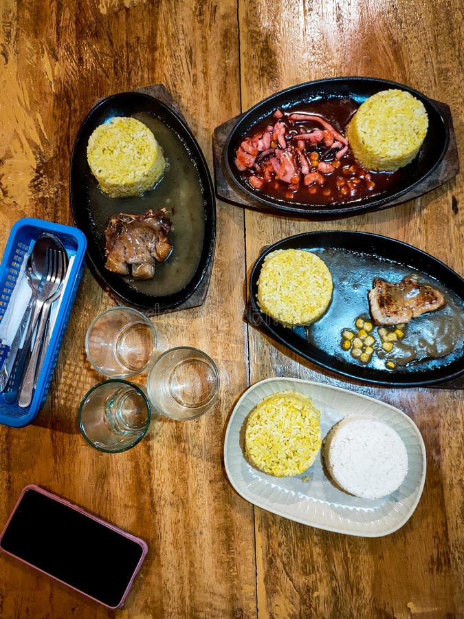 Sizzling Plated Meals stock photo. Image of restaurant - 234123896