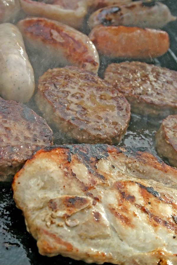 Sizzling Smokey Barbecue stock photo. Image of cook, barbeque - 1077054