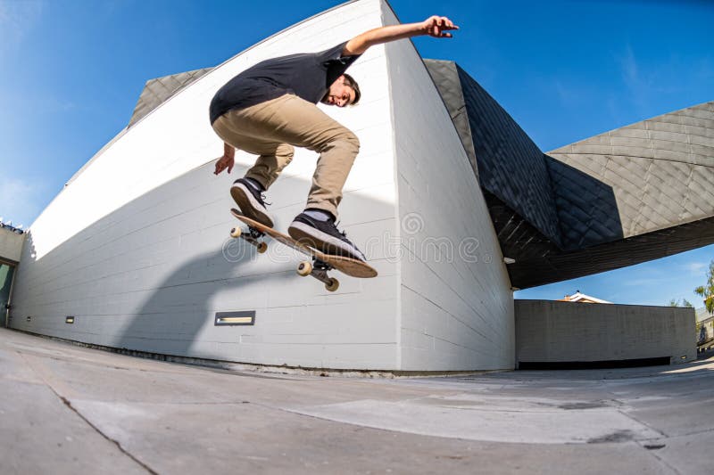 Skateboarder Doing Nollie Trick Stock Photo - Image of concrete ...