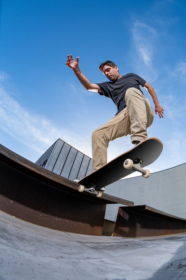 Skateboarder Doing a Nose Slide Trick Stock Image - Image of skateboard ...