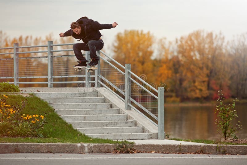 Skateboarder Doing a Ollie Down the Stairs Stock Photo - Image of rail ...