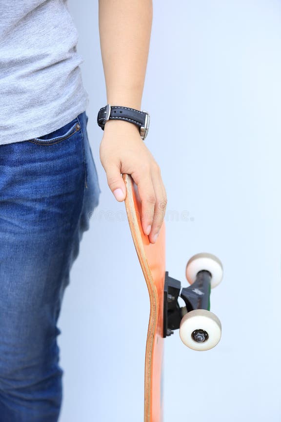 Skateboarder lean on wall stock image. Image of skateboard - 64209019