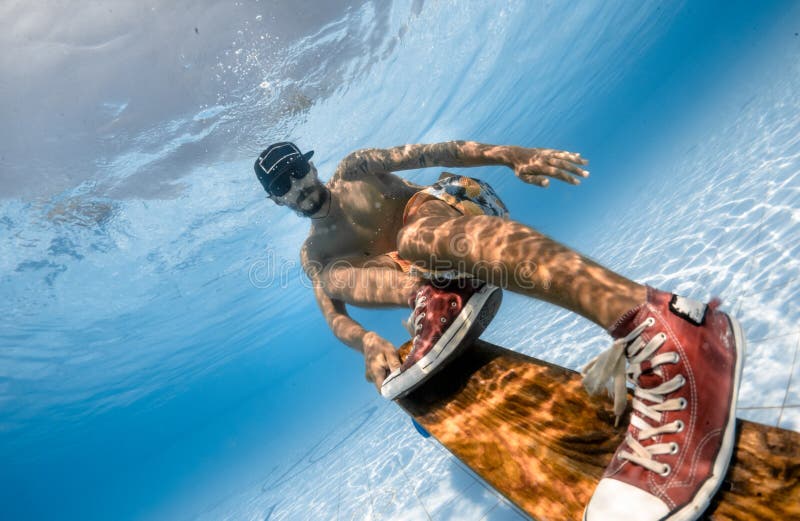 Skateboarding underwater stock photo. Image of dive, skate - 76219852