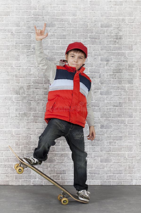 Skater boy showing V-sign stock image. Image of person - 37514445
