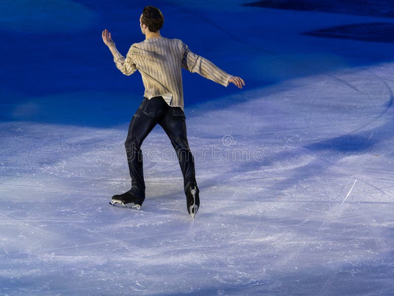 Skater Performing Artistic and Technical Performance on the Ice Rink ...
