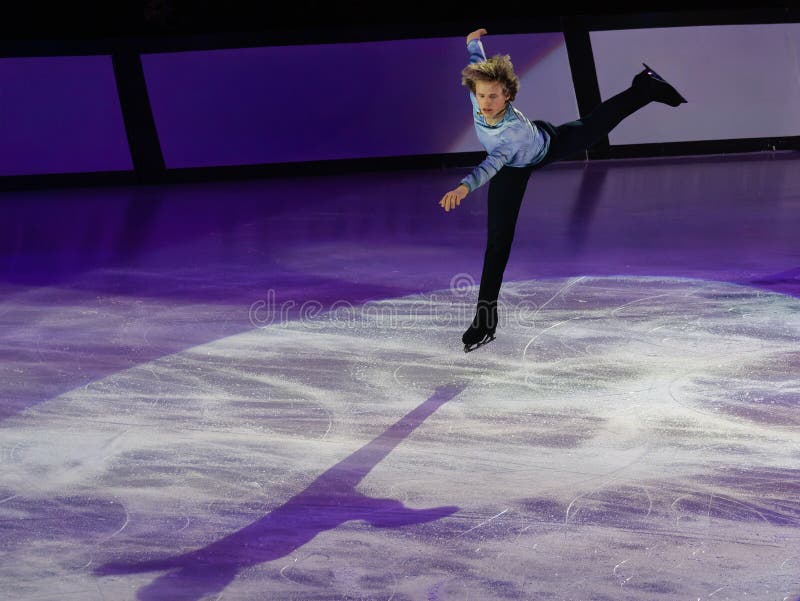 Skater Performing Artistic and Technical Performance on the Ice Rink ...