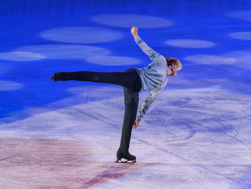 Skater Performing Artistic and Technical Performance on the Ice Rink ...