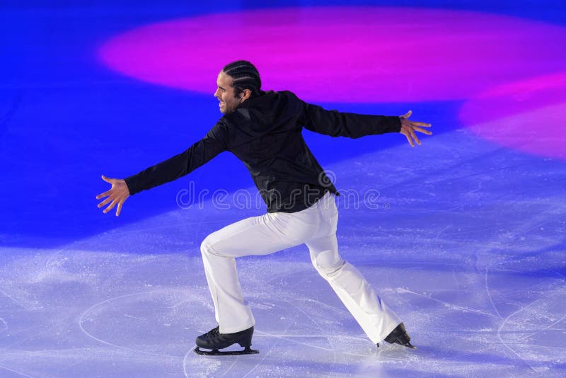 Skater Performing Artistic and Technical Performance on the Ice Rink ...