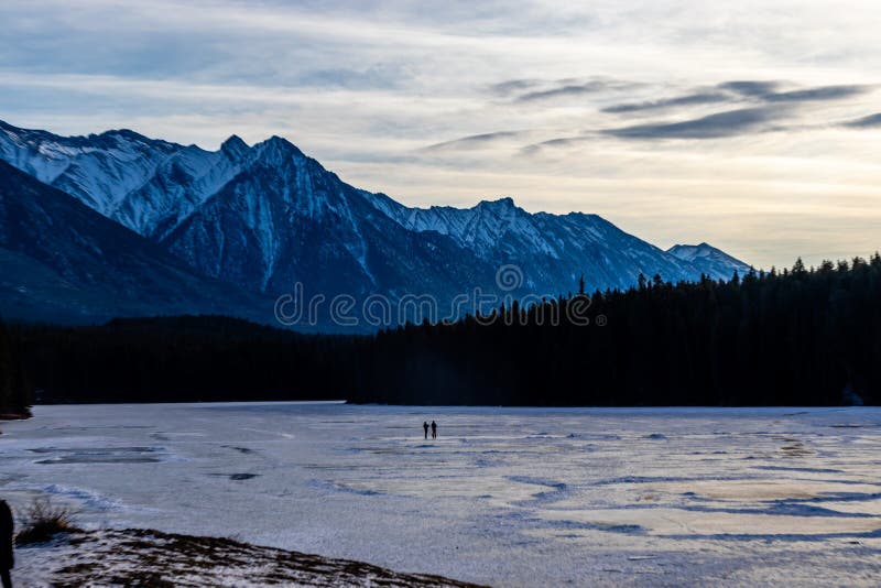 Skaters on Johnson Lake. Banff National Park, Alberta, Canada Stock ...