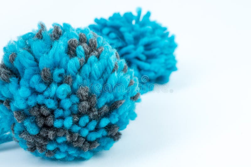 Skein of Blue Threads for Knitting on a White Background. Pompon Stock ...