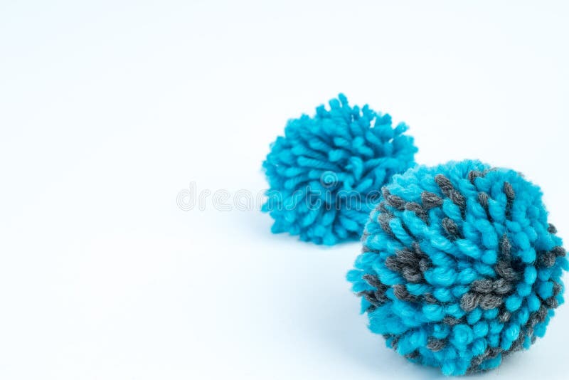 Skein of Blue Threads for Knitting on a White Background. Pompon Stock ...