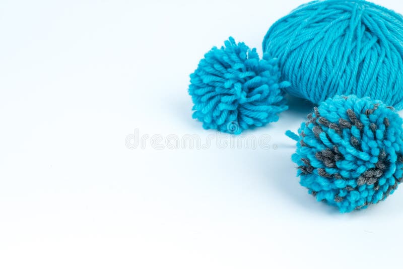 Skein of Blue Threads for Knitting on a White Background. Pompon Stock ...