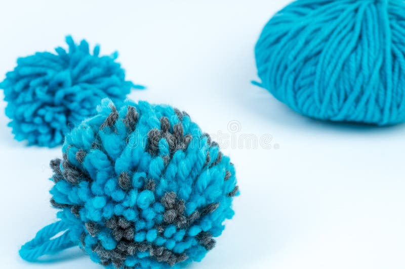 Skein of Blue Threads for Knitting on a White Background. Pompon Stock ...