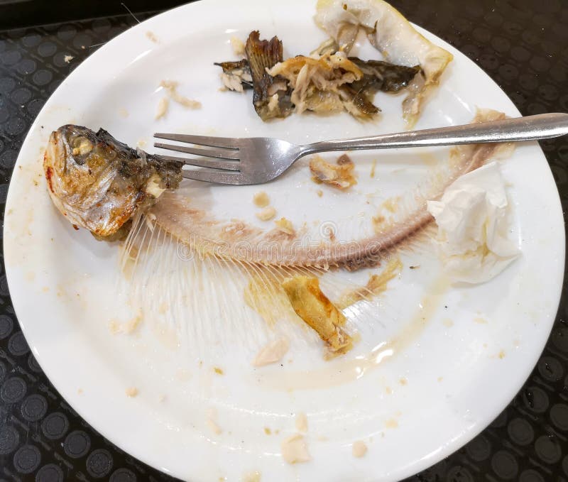 Skeleton of Fish in a Plate with a Fork Stock Photo - Image of food ...
