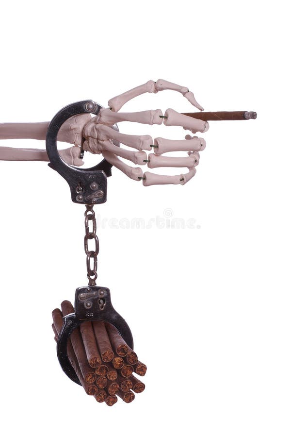 Skeleton Hand Holding Cigar with Handcuff Stock Photo - Image of ...