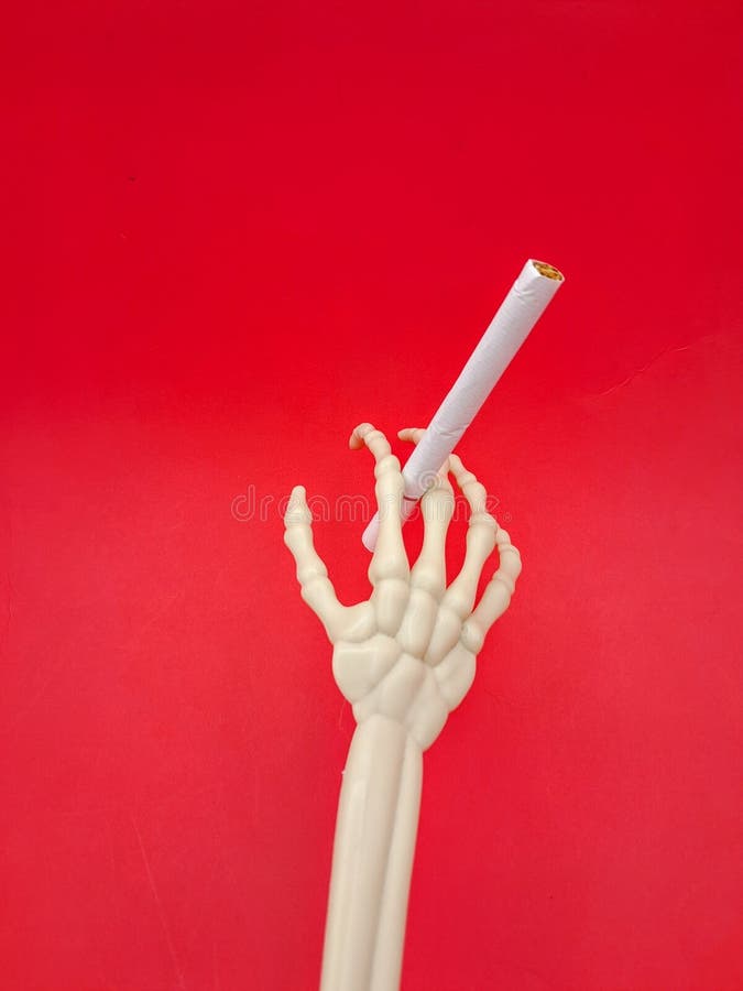Skeleton Hand Smoking a Cigarette Stock Photo - Image of smoke ...