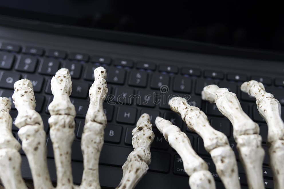 Skeleton Hands Typing a Report Using a Keyboard - Halloween Concept ...