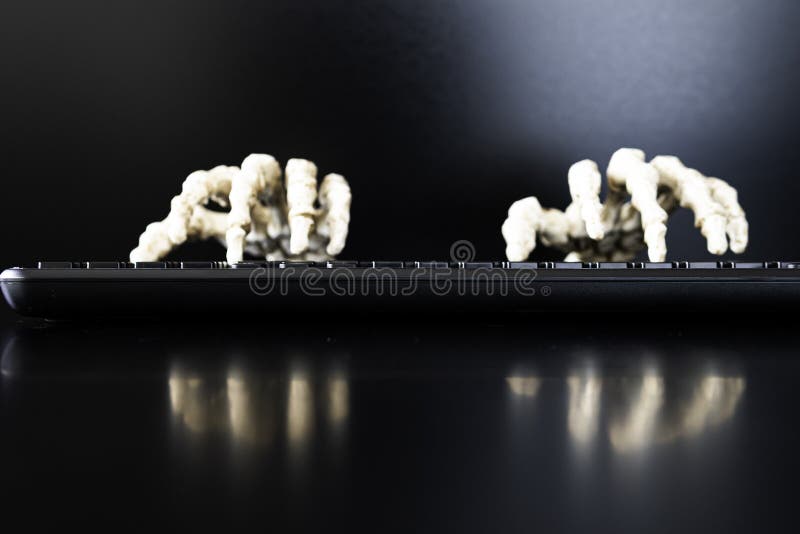 Skeleton Hands Working on Computer for Halloween Stock Photo - Image of ...