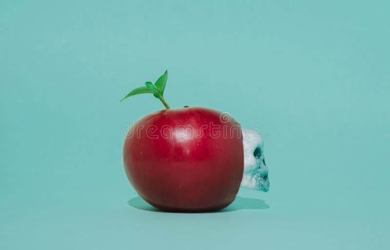 Skeleton Head Coming Out of a Red Apple. Blue Background Stock Image ...