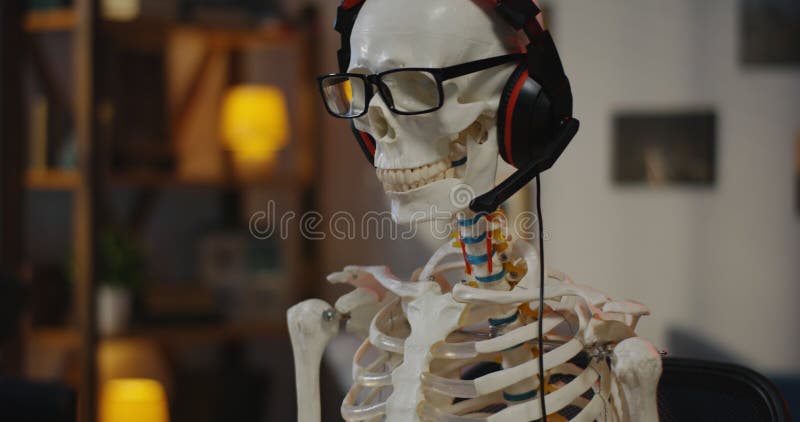 Skeleton with Headphone Sitting at Computer Stock Image - Image of ...