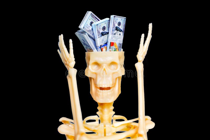 Skeleton with Money in Its Head Against Black Background Stock Photo ...